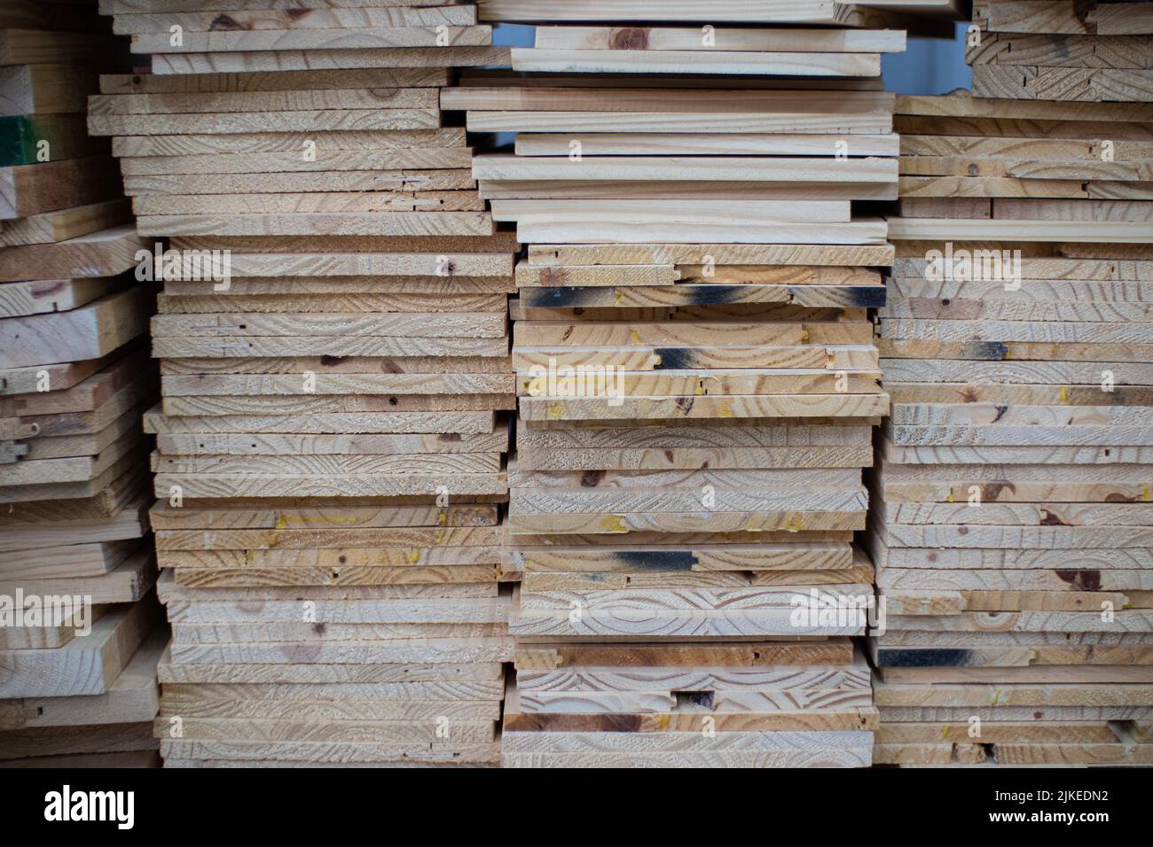stack of different wood pieces of wooden in a carpentry shelf ...