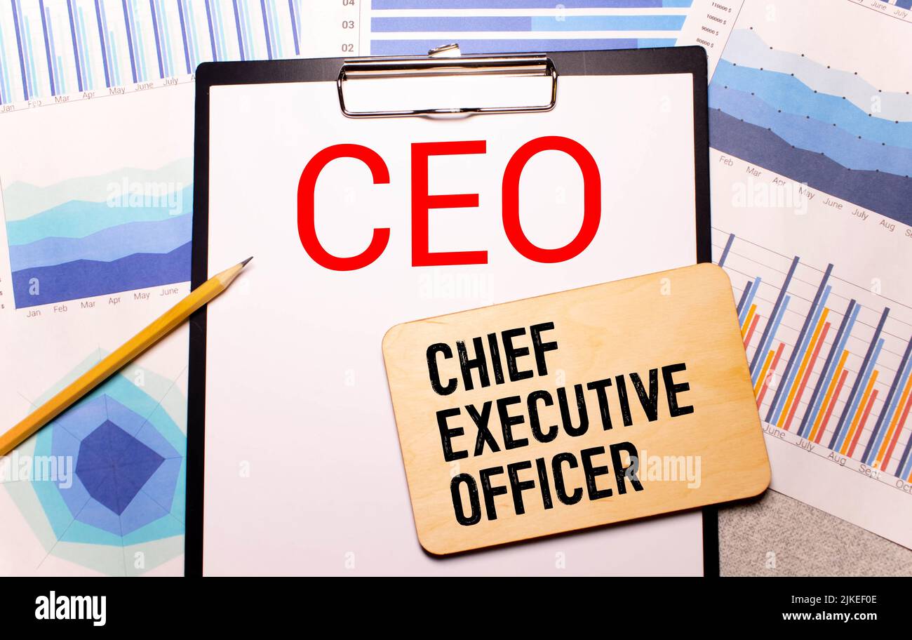 CEO text on a wooden block on chart background Stock Photo - Alamy