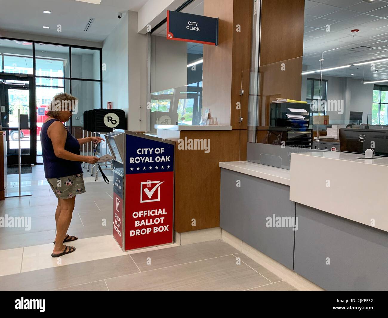 Royal Oak, Michigan, USA. 1st Aug, 2022. A Michigan voter drops her ...