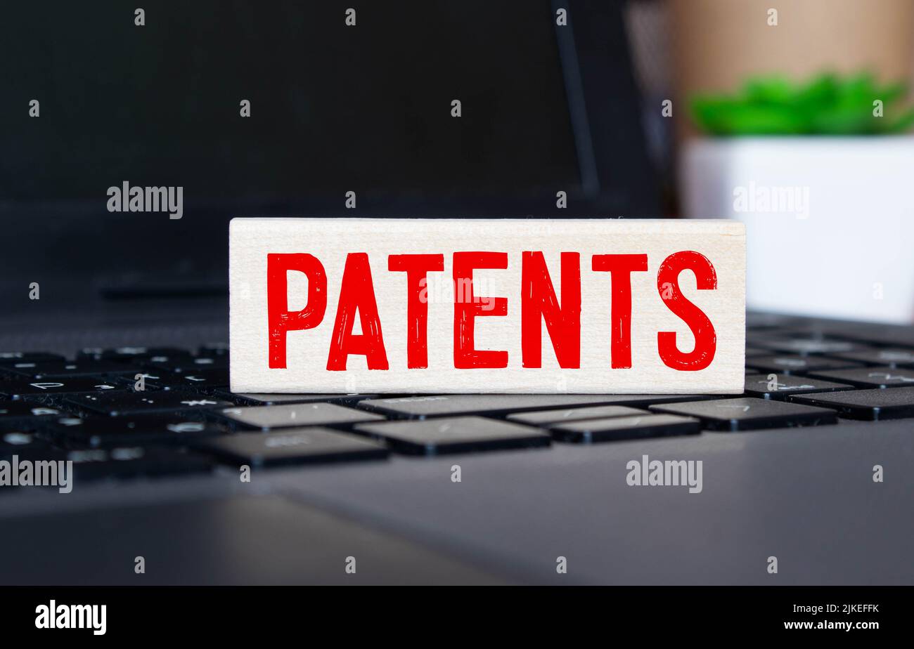 Closed up finger on keyboard with word PATENT Stock Photo - Alamy