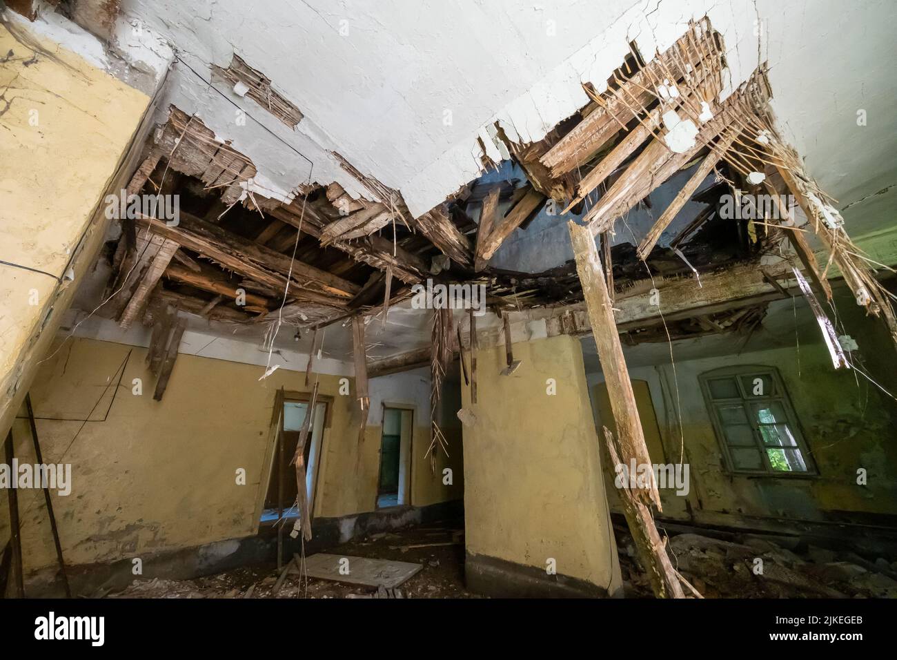 Broken ceiling inside derelict building Stock Photo - Alamy