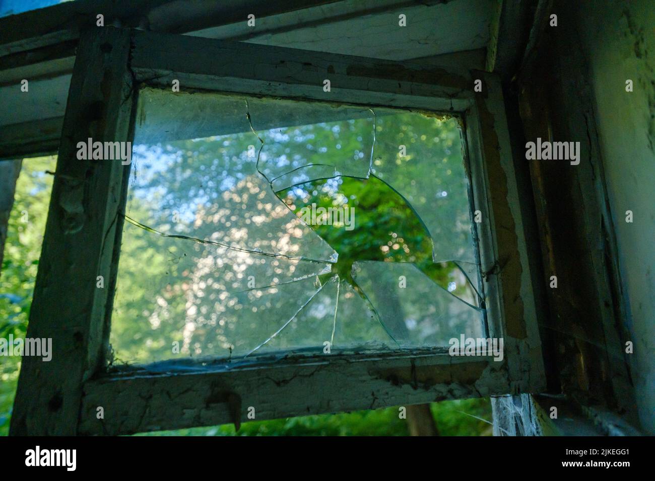 Broken window with wooden frame Stock Photo - Alamy