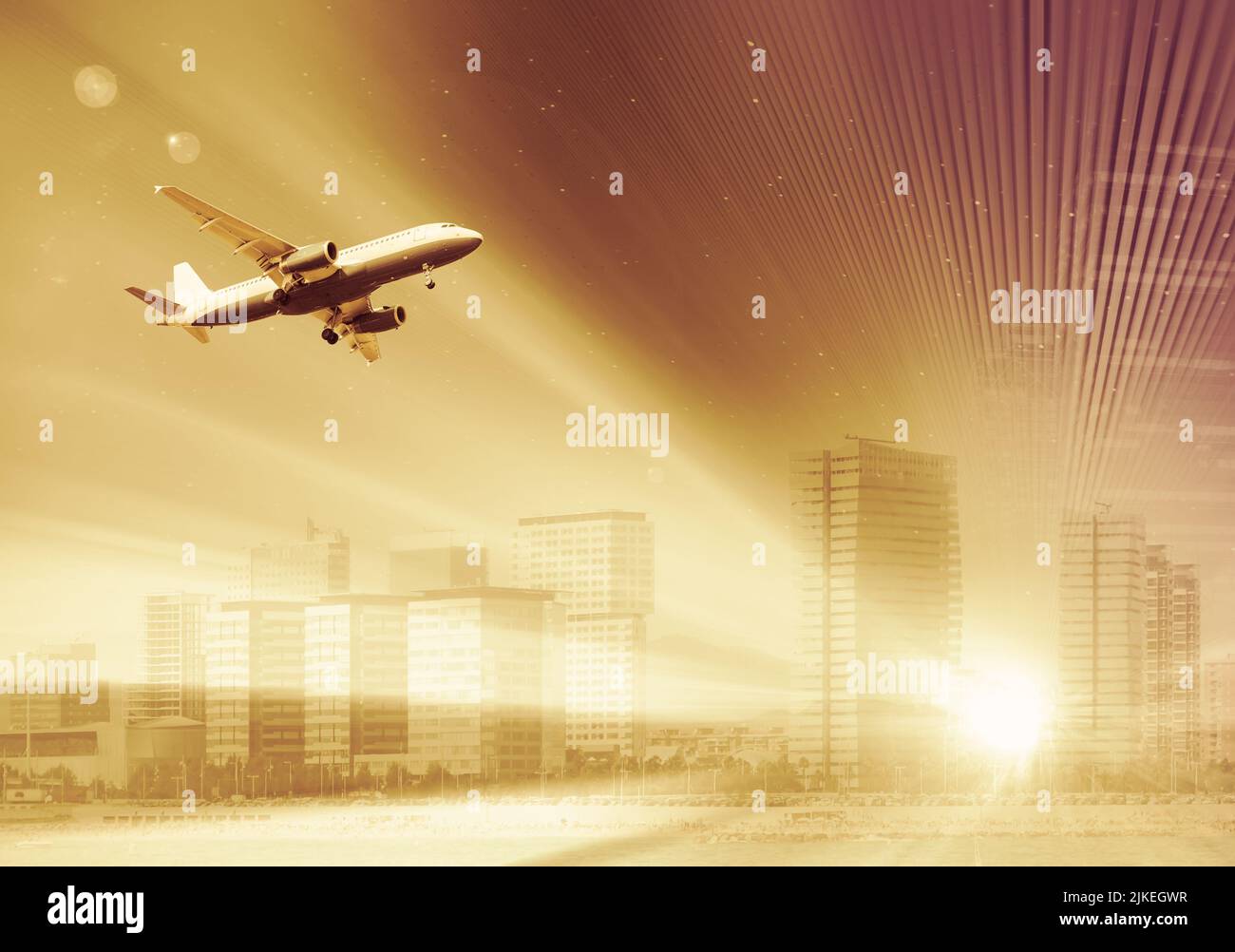 Plane flying rapidly over the buildings Stock Photo - Alamy