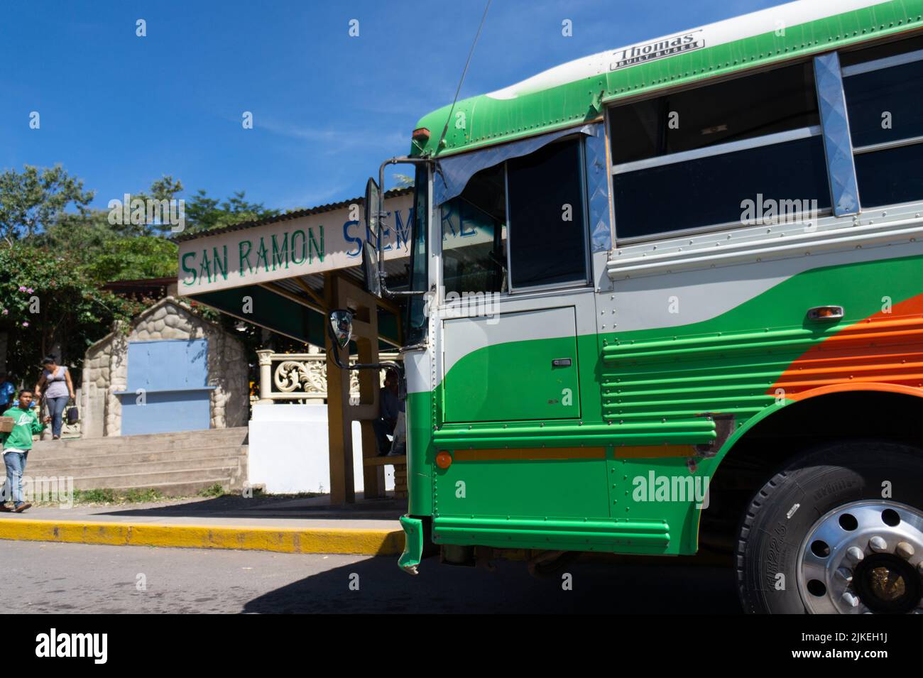 Converted United States school bus in front of bus station for San ...