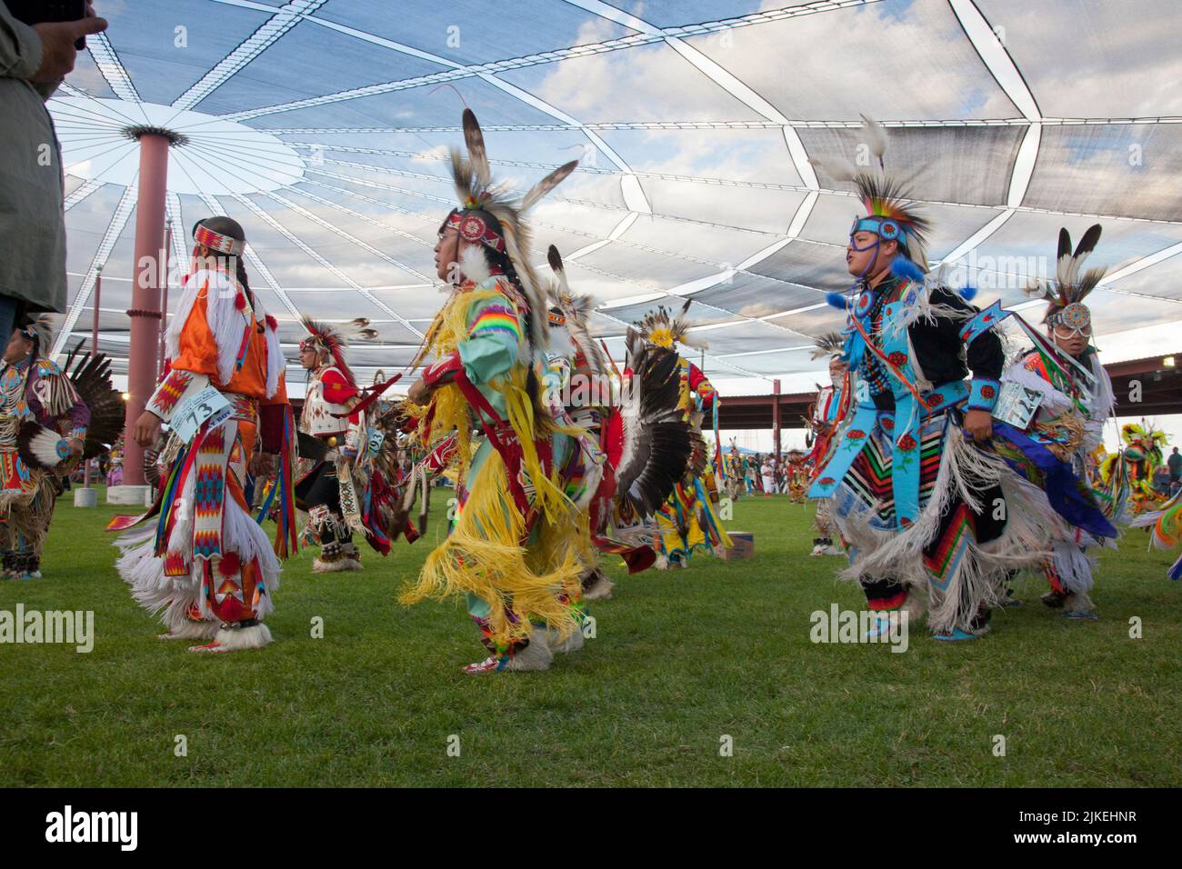 Group of adult men dressed in traditional grass dancer outfits at the ...