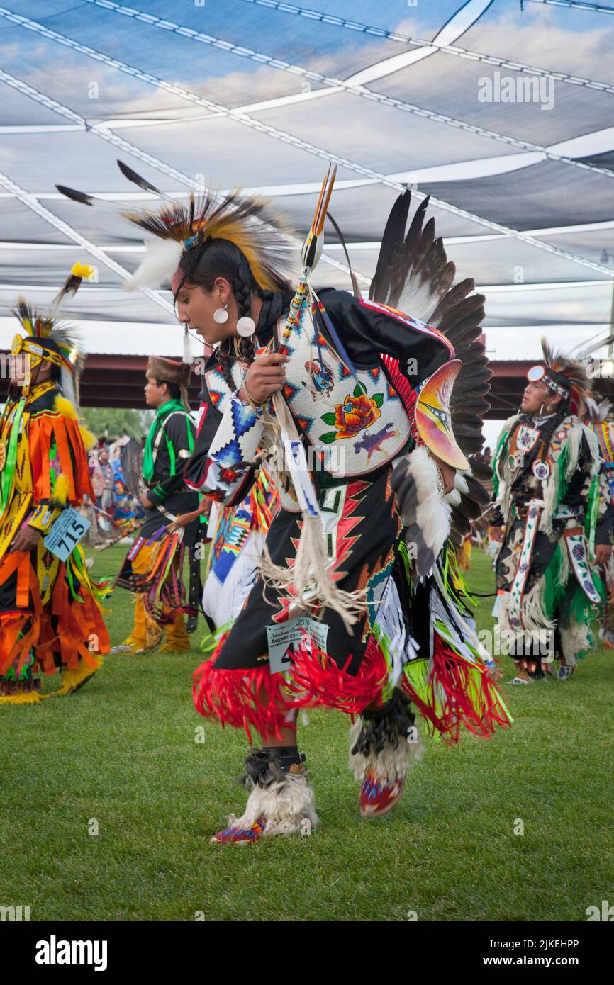 Grass dancer dressed in colorful outfit dances at the Shoshone Bannock Pow Wow, Fort Hall Idaho ...