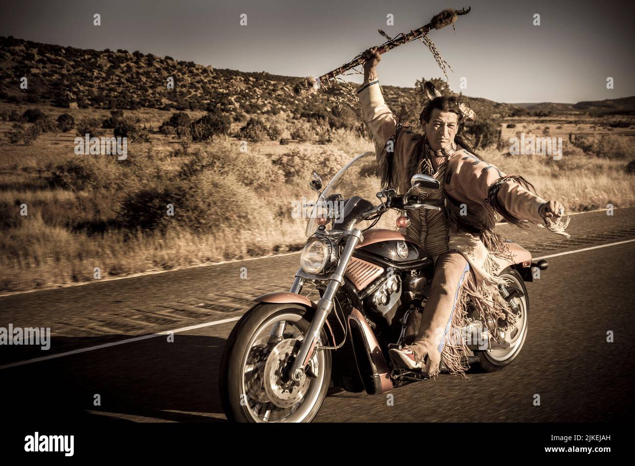 Sepia toned artwork of a traditionally dressed Arapahoe man holds up ...