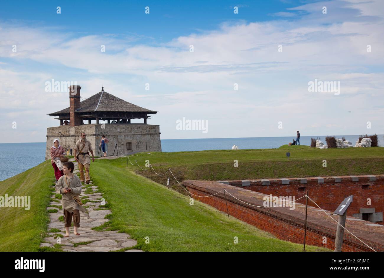 Stone lookout building sits on bluff and overlooks Lake Ontario. Old ...