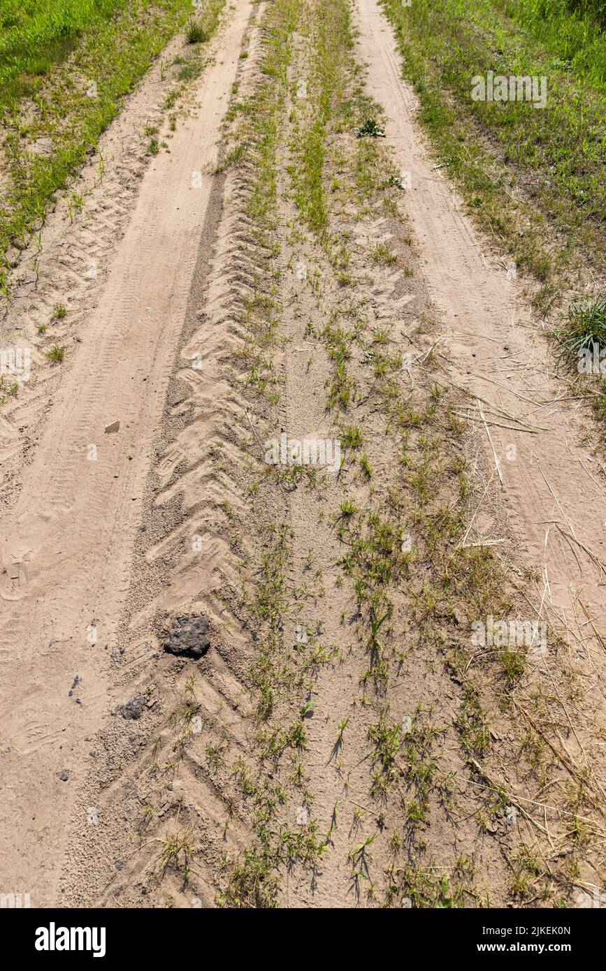 unpaved highway in rural areas, part of the road for cars without ...