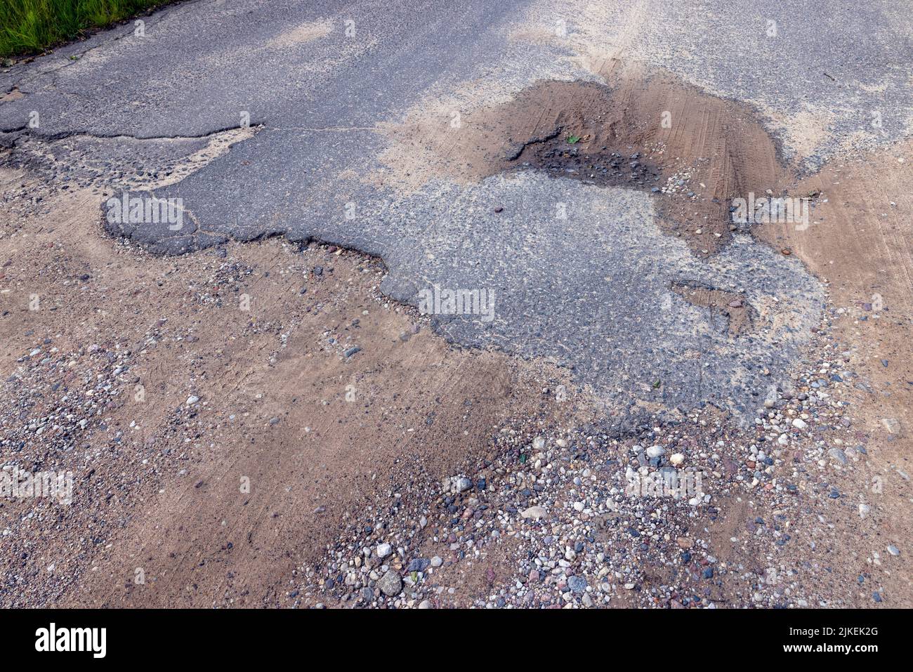 the place of transition from an asphalt road to a dirt road, poor ...