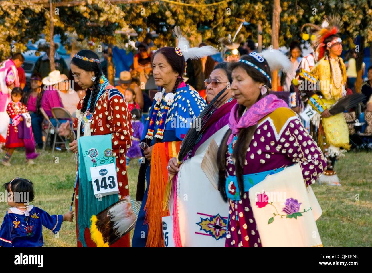 dressed in wool felt dresses decorated with elk teeth at a pow wow on ...