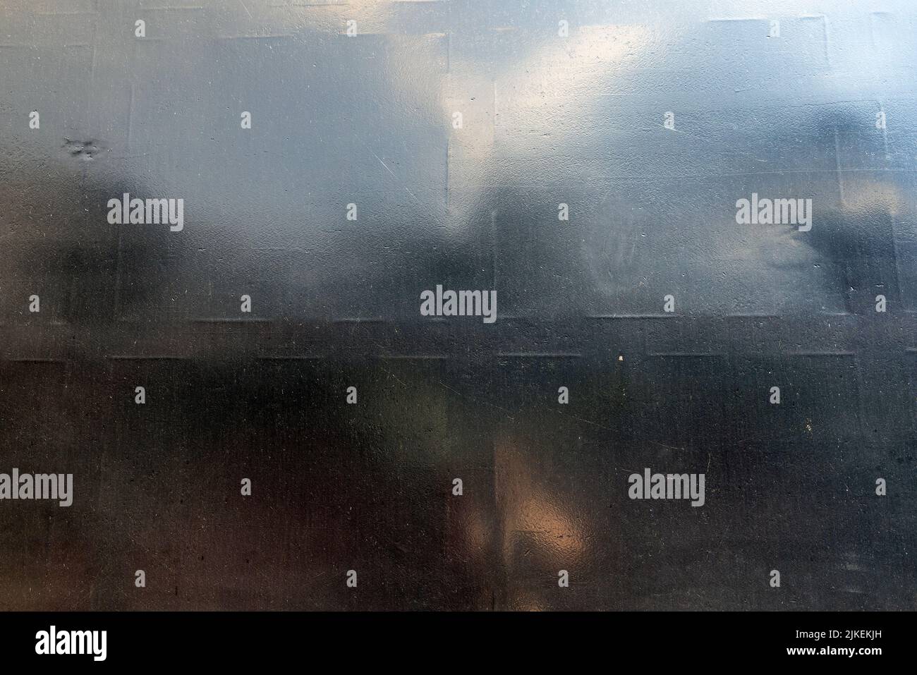 Part of the metal structure of an old steam locomotive, a sheet of ...