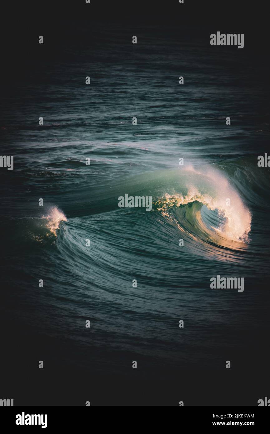 Sunset Rolling surf. Beauty of Mother nature Stock Photo - Alamy