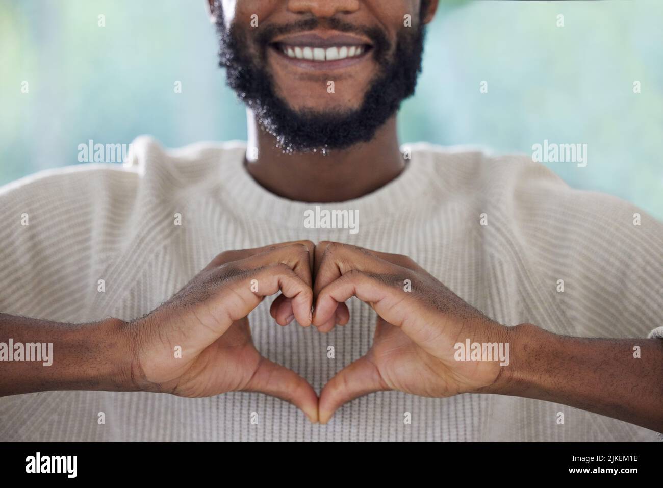 Always take care of your heart. an unrecognizable man making a heart ...