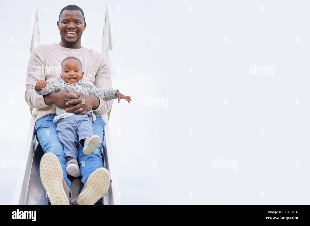 Family is the essential cell of human society. a father and son playing ...