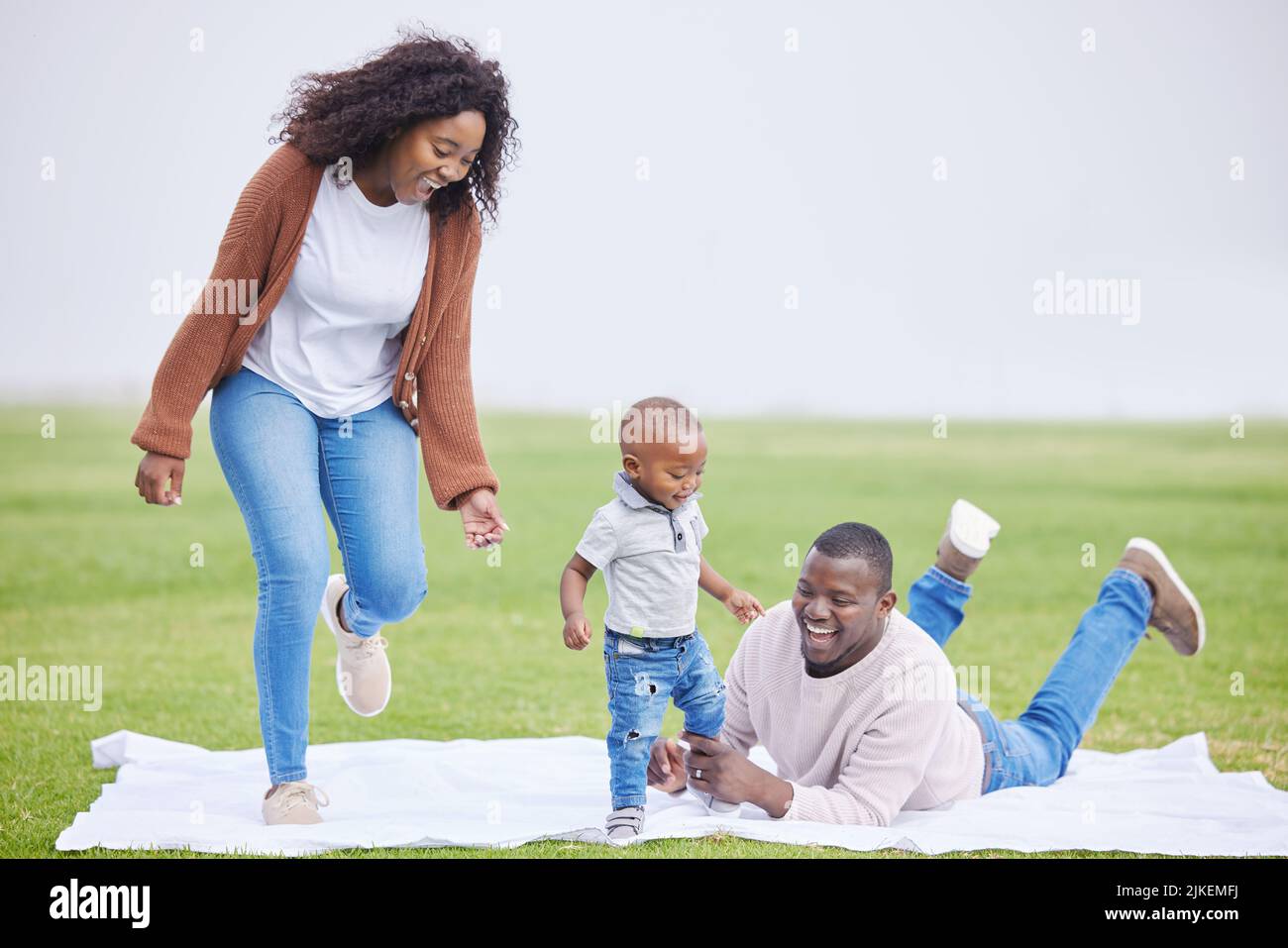 The best toys a child can have is parents. a young couple having a ...