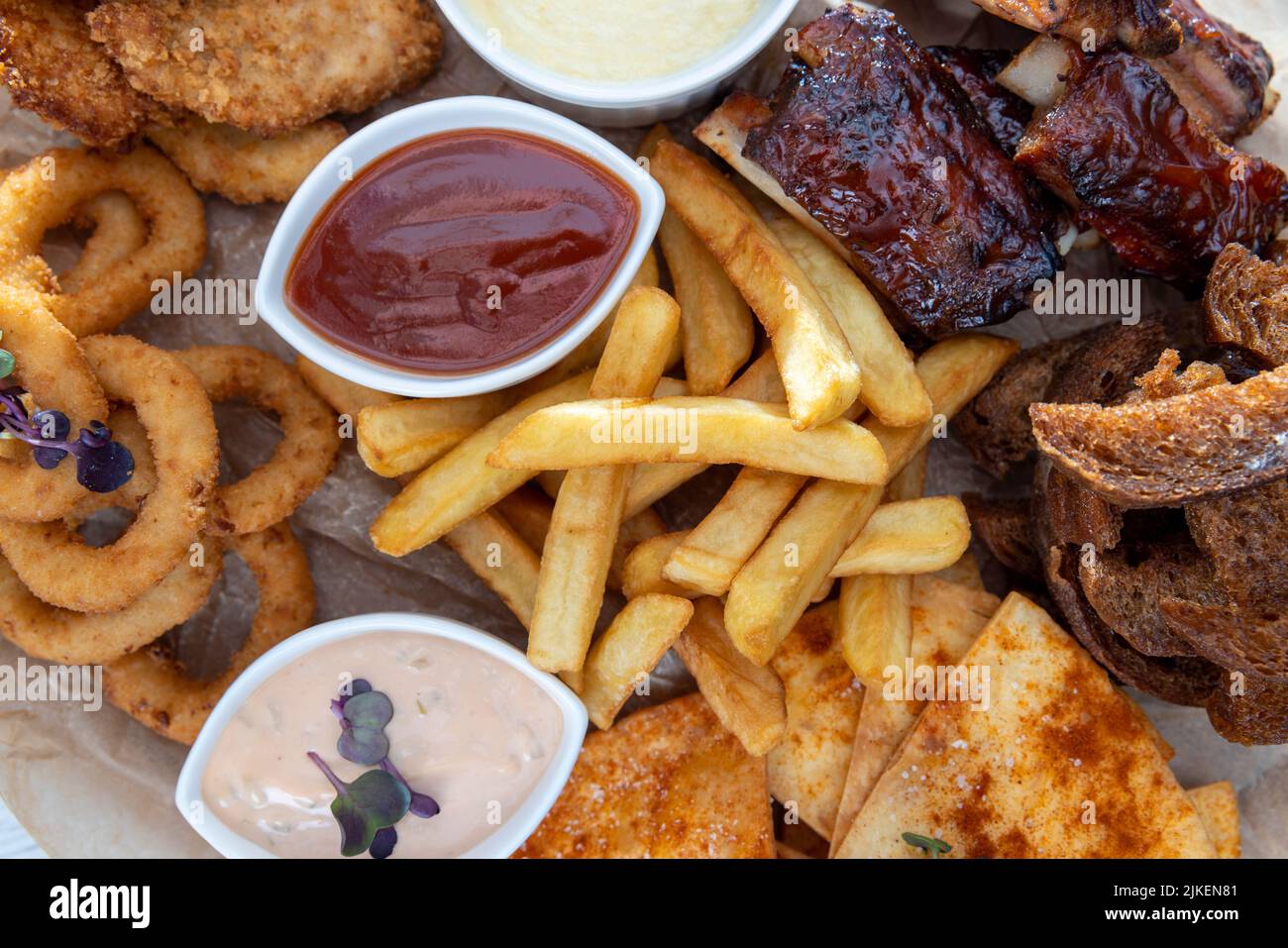 a set of different types of products fried together, French fries ...