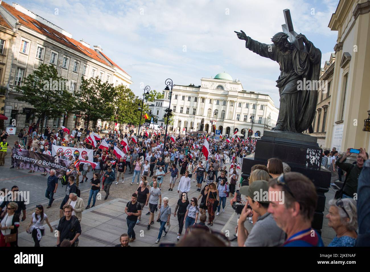 Warsaw, Poland. 01st Aug, 2022. A crowd of people seen marching to ...