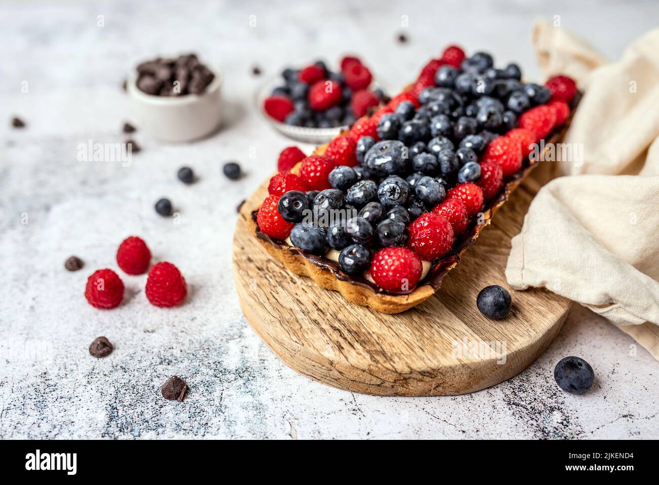 Fruit Tart full of Berries with chocolate and cream on cookie crust ...