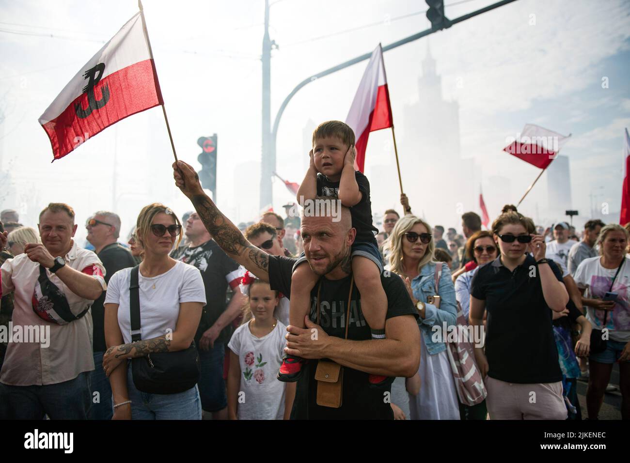 Warsaw, Poland. 01st Aug, 2022. Participants wave polish flags during ...