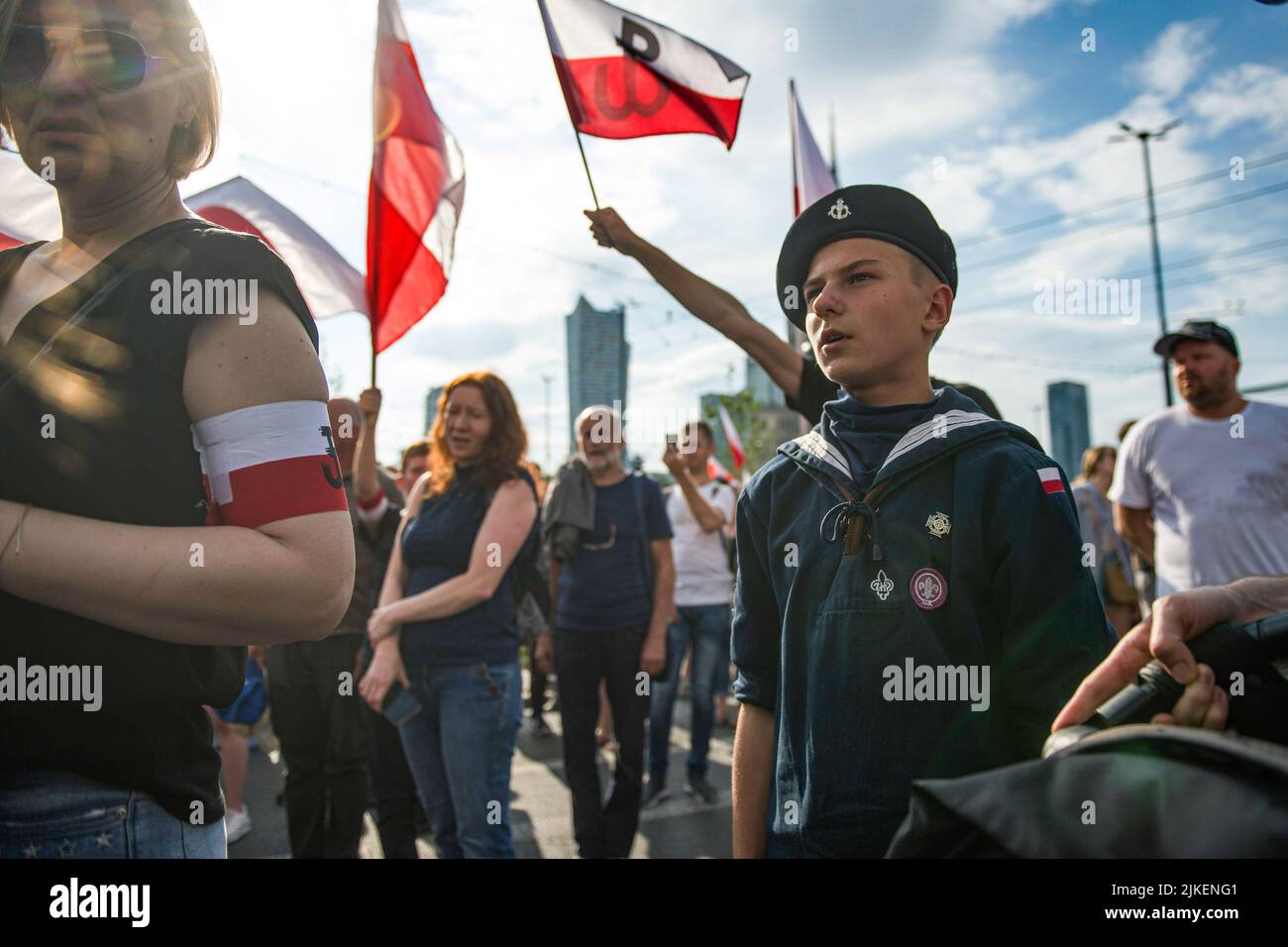 Warsaw, Poland. 01st Aug, 2022. A boy in navy school uniform sings ...