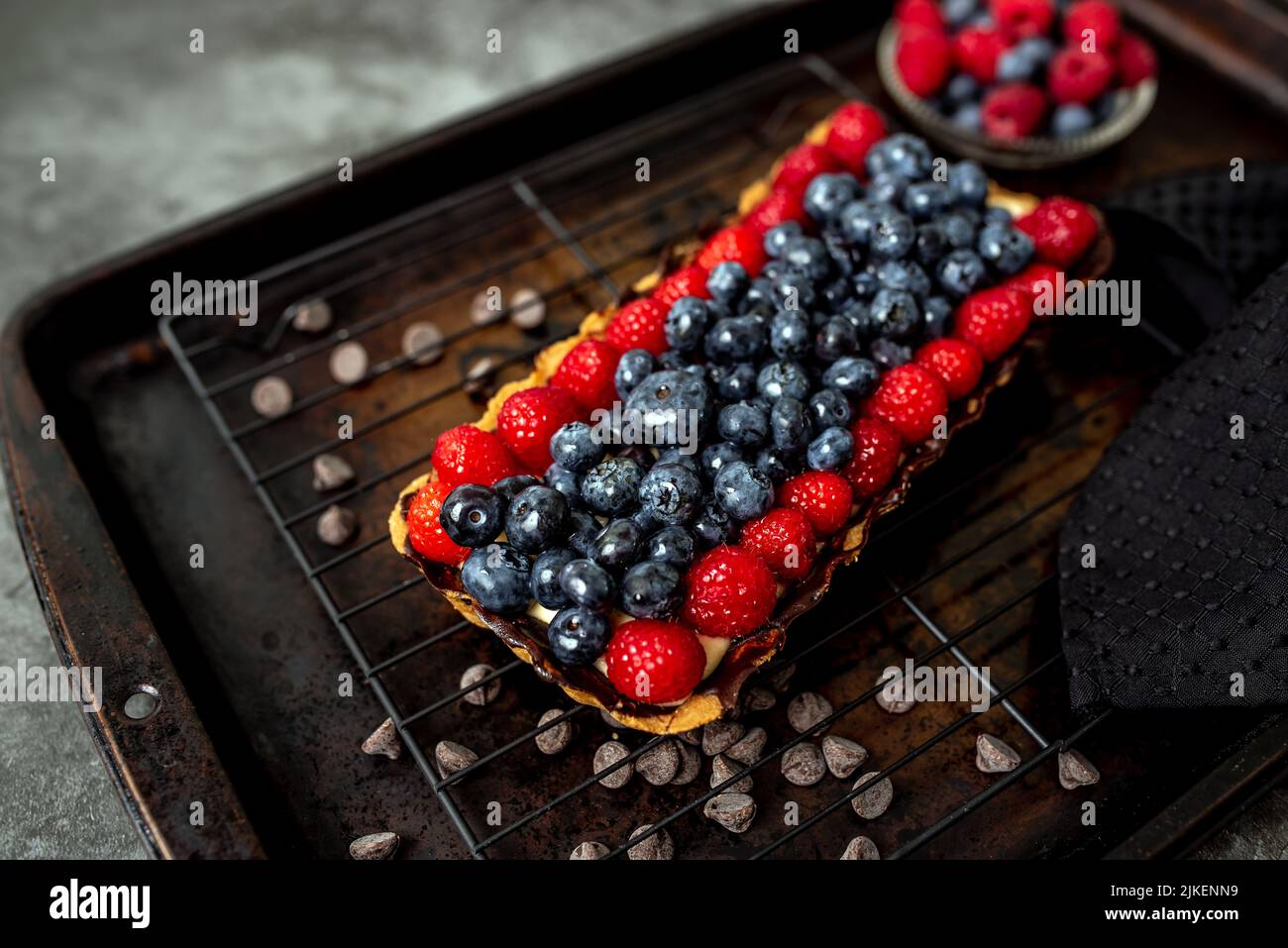 Fruit Tart full of Berries with chocolate and cream on cookie crust ...