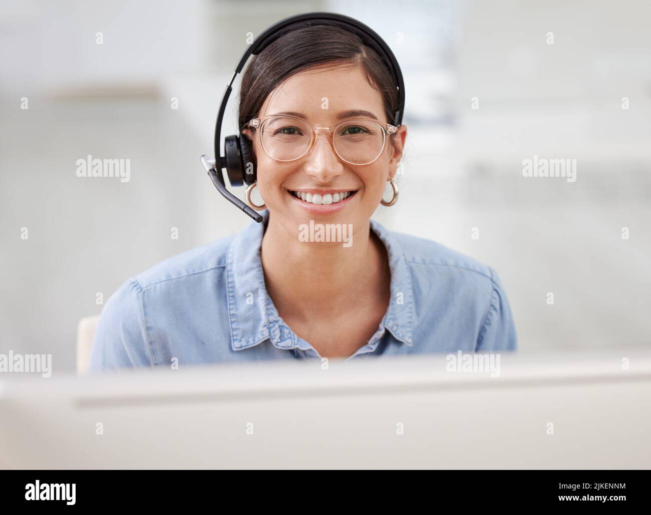 Always ready to help. a young businesswoman working at a call center ...
