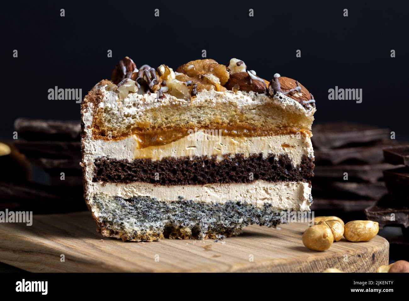 multi-layer cake with different layers, caramel, poppy seeds and cream ...
