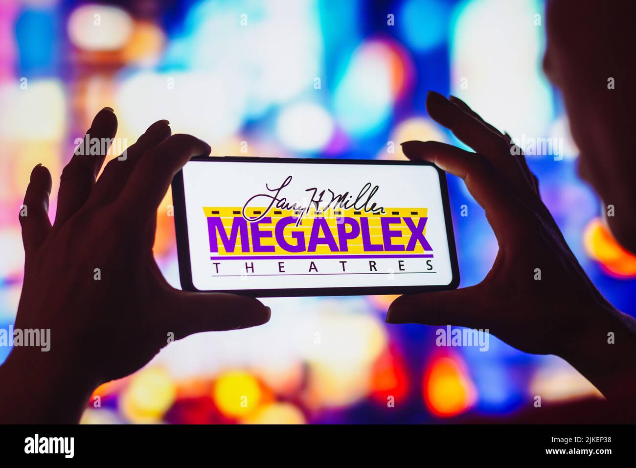 In this photo illustration, the Megaplex Theatres logo is displayed on a smartphone screen ...
