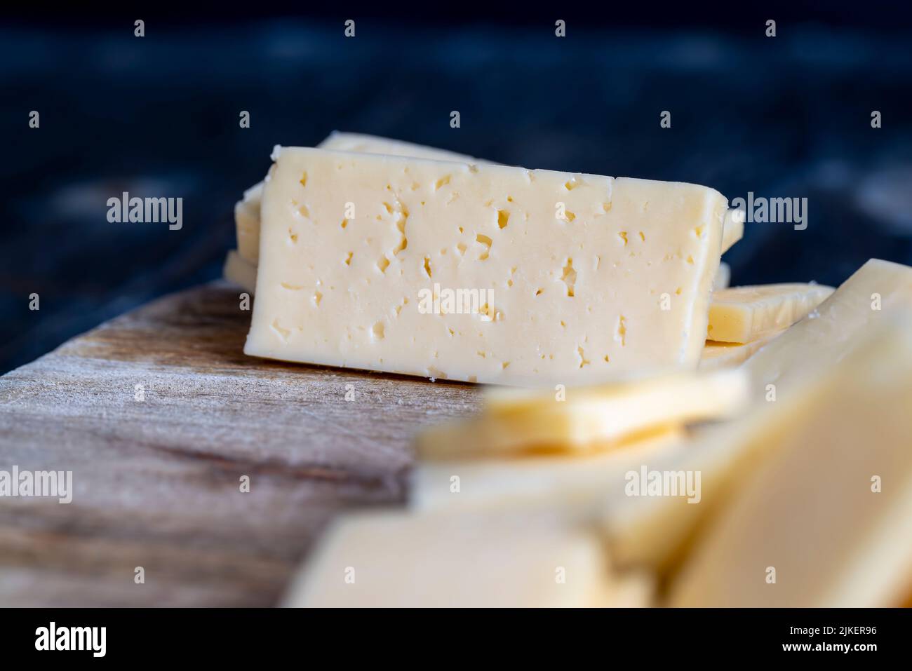 cut into pieces real hard cheese with lots of milk, the product of milk ...