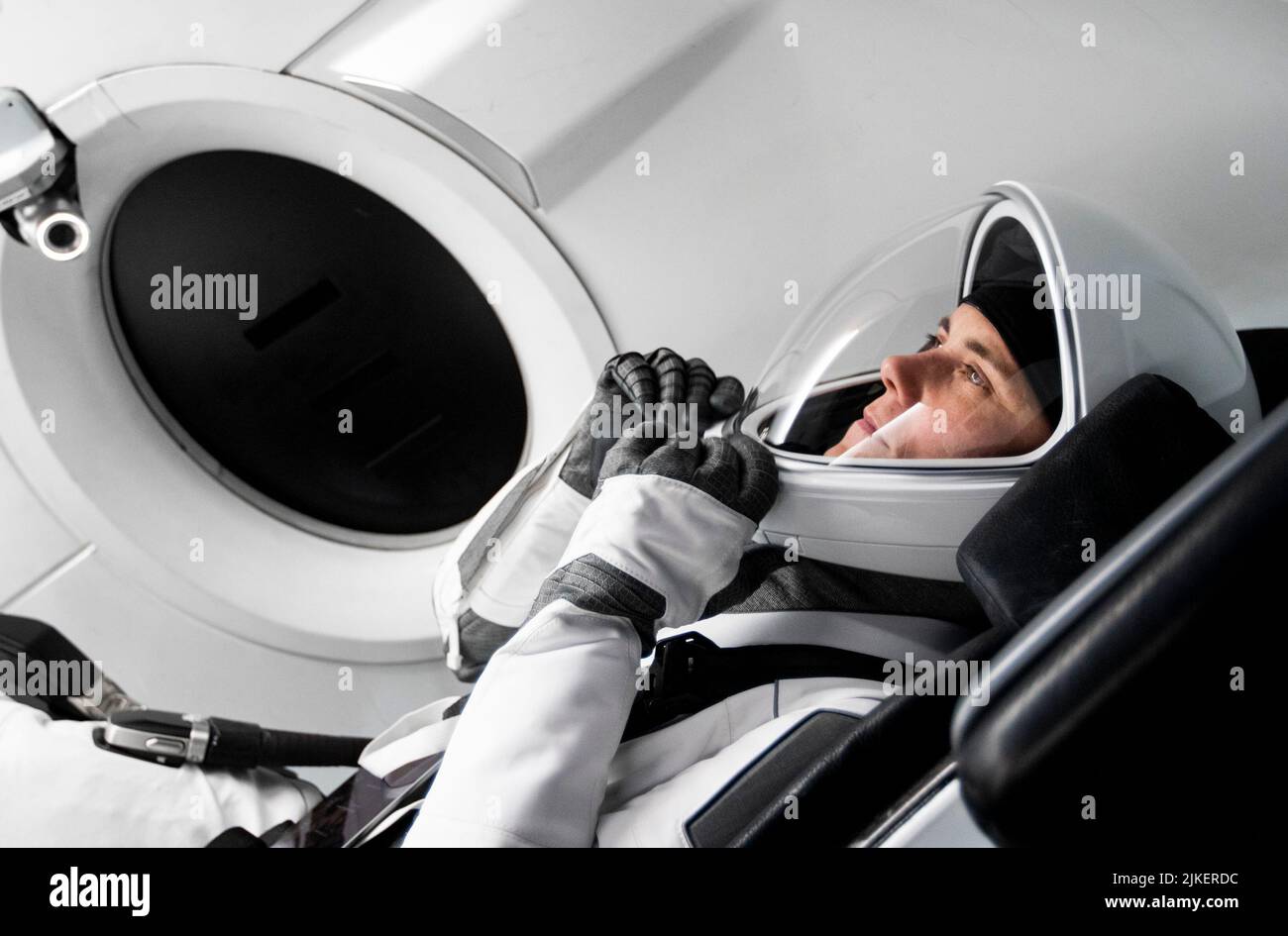 Cosmonaut Anna Kikina sits in a mockup of the spacecraft that will take ...