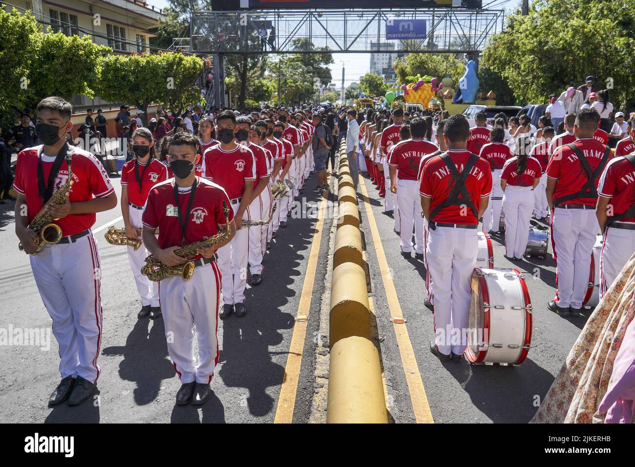 Members of a marching band march during a parade at the beginning of ...