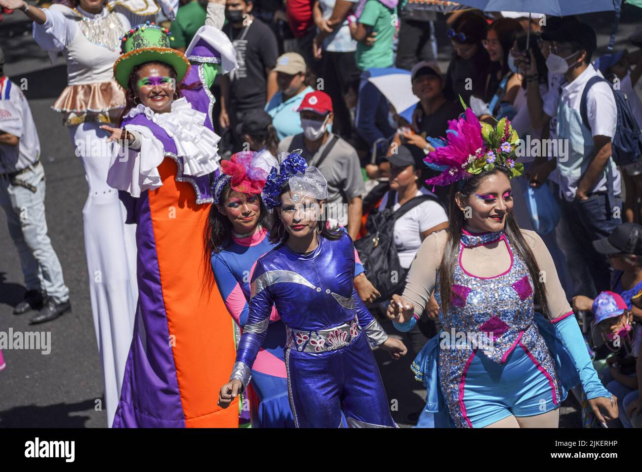 People march during a parade at the beginning of the Divine Saviour of ...