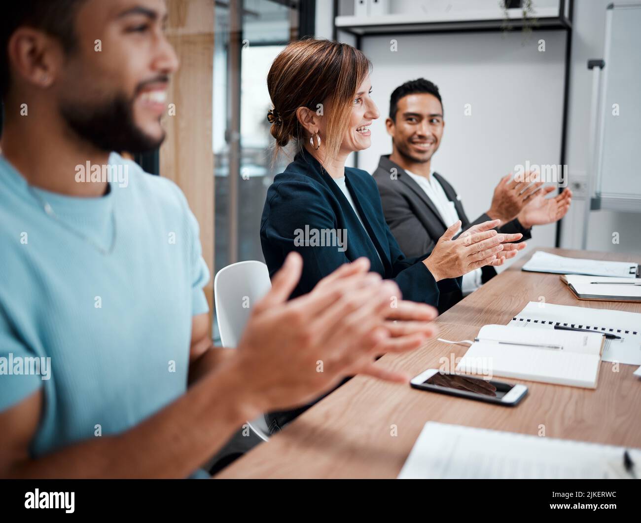 Were so happy to meet you. a group of coworkers clapping during a ...