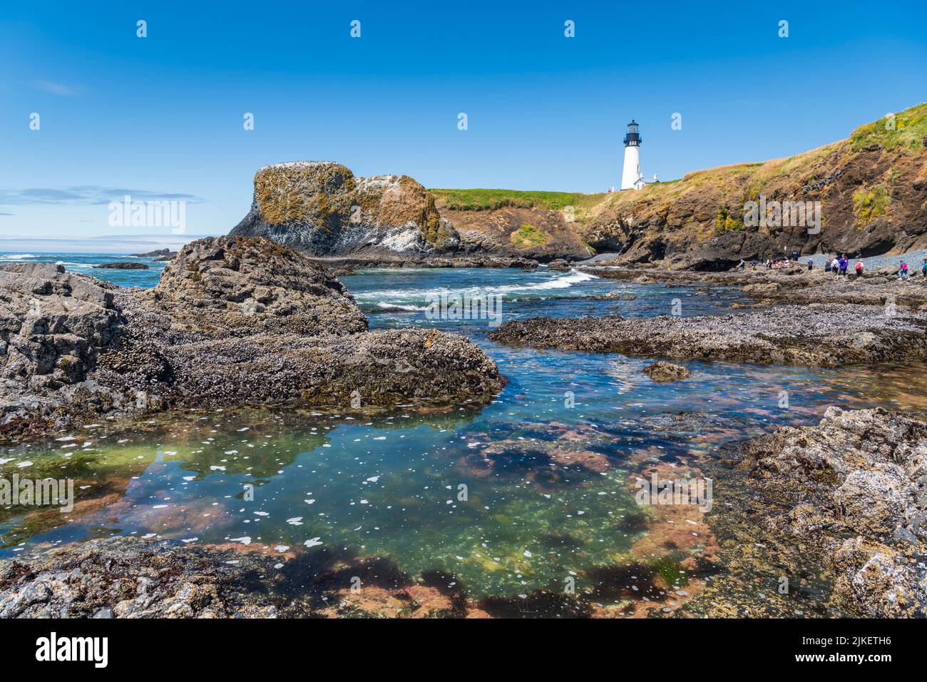 Yaquina Head Lighthouse and tidal pools seen from Agate Beach, Pacific ...