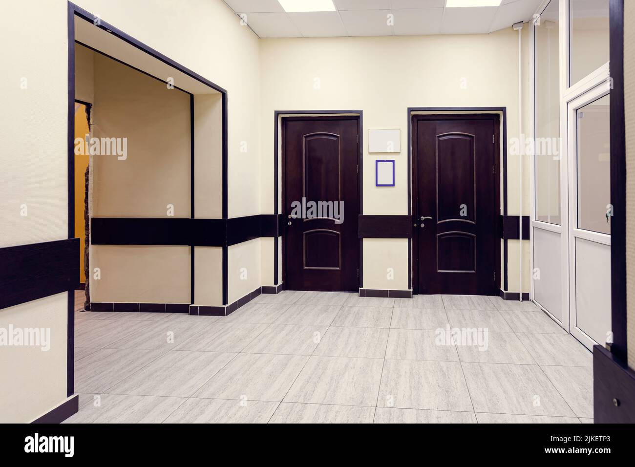 School corridor, hallway of college or university. Light yellow walls ...