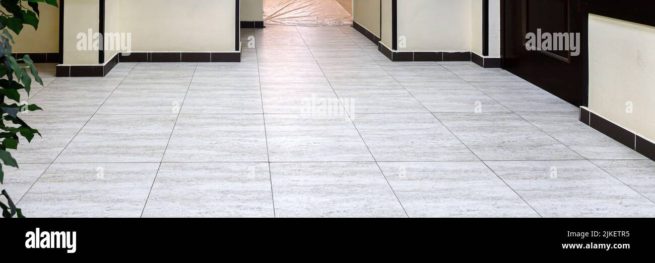Light tiled floor, contemporary architecture. School corridor, hallway ...