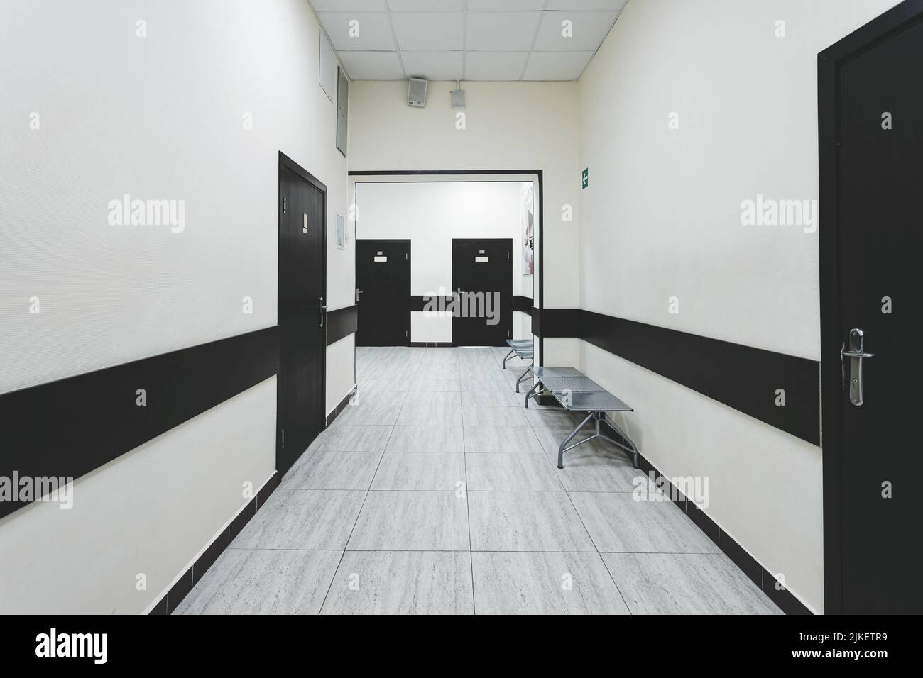 School corridor, hallway of college or university. Light yellow walls ...