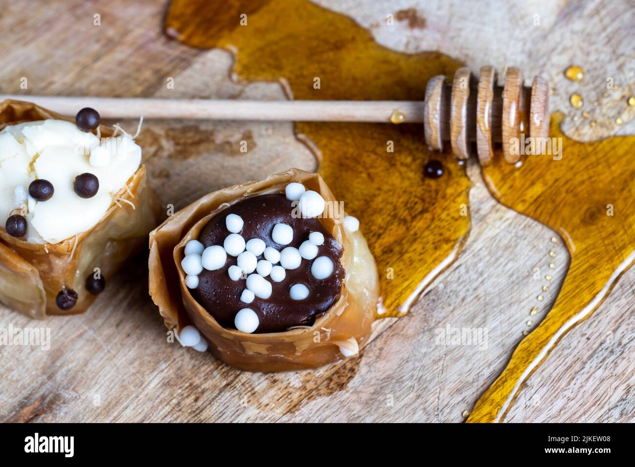 sweets made of thin puff pastry with chocolate filling and honey ...