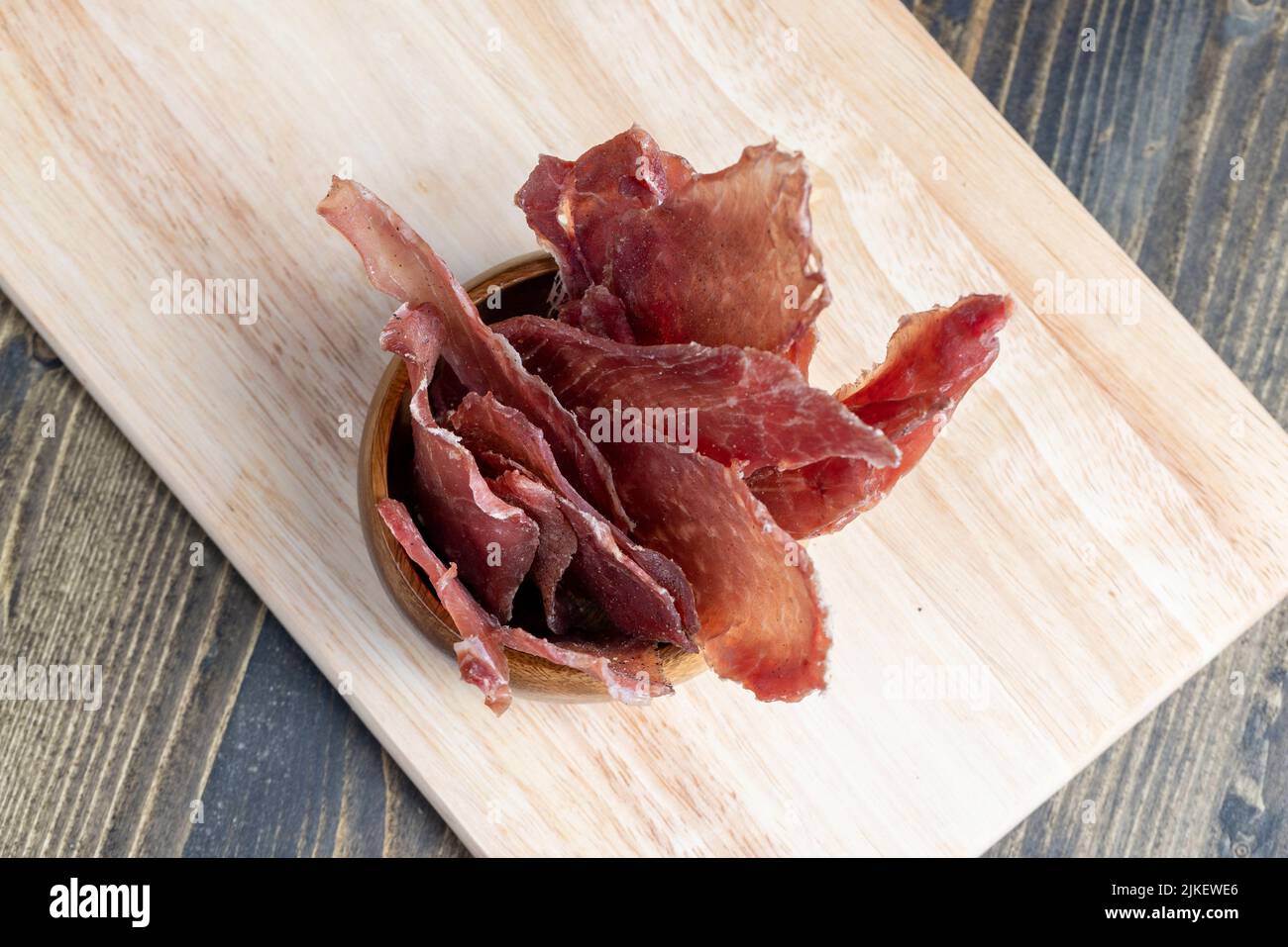 thin pieces of dried meat with spices , pork meat food during cooking ...