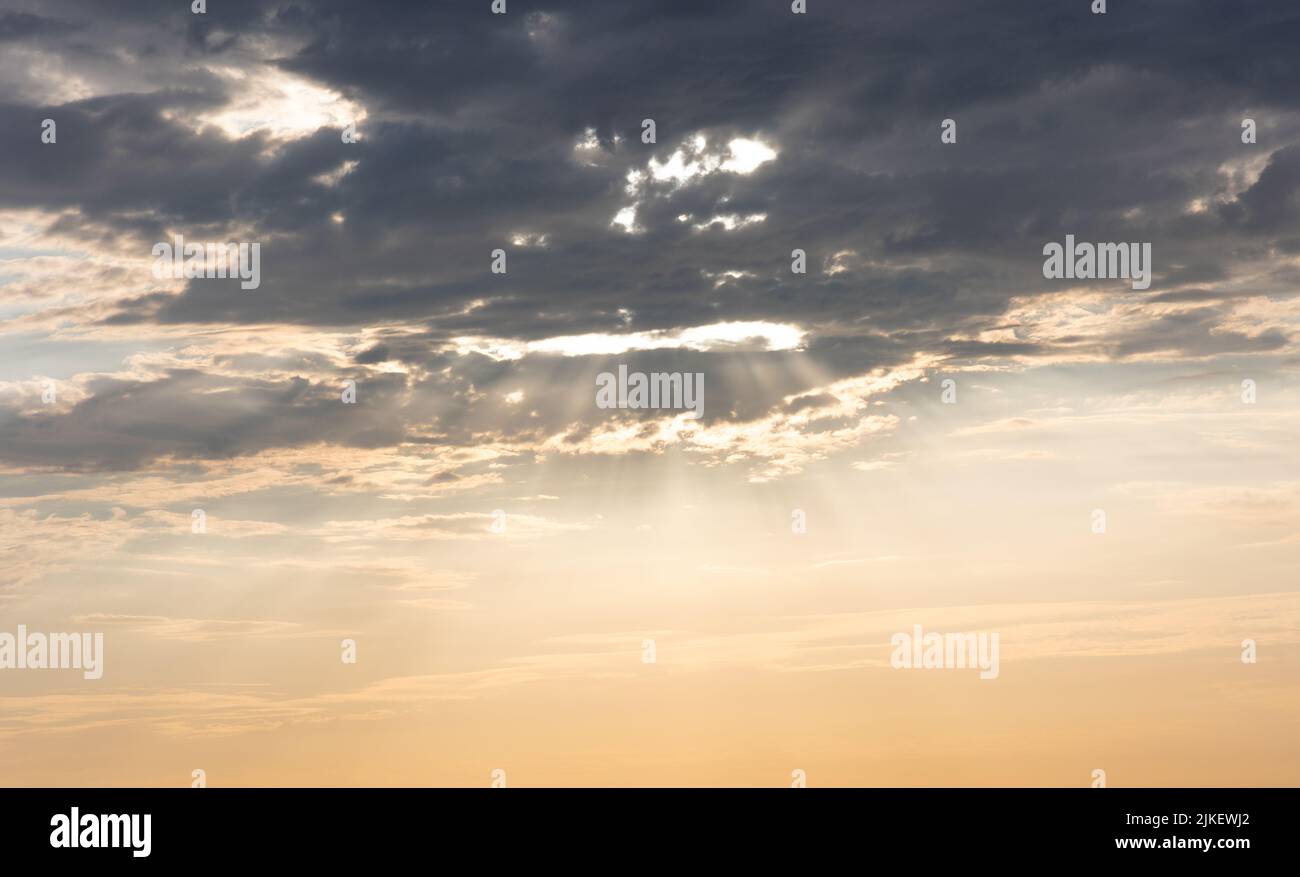 Light rays bursting through a cloud Stock Photo - Alamy
