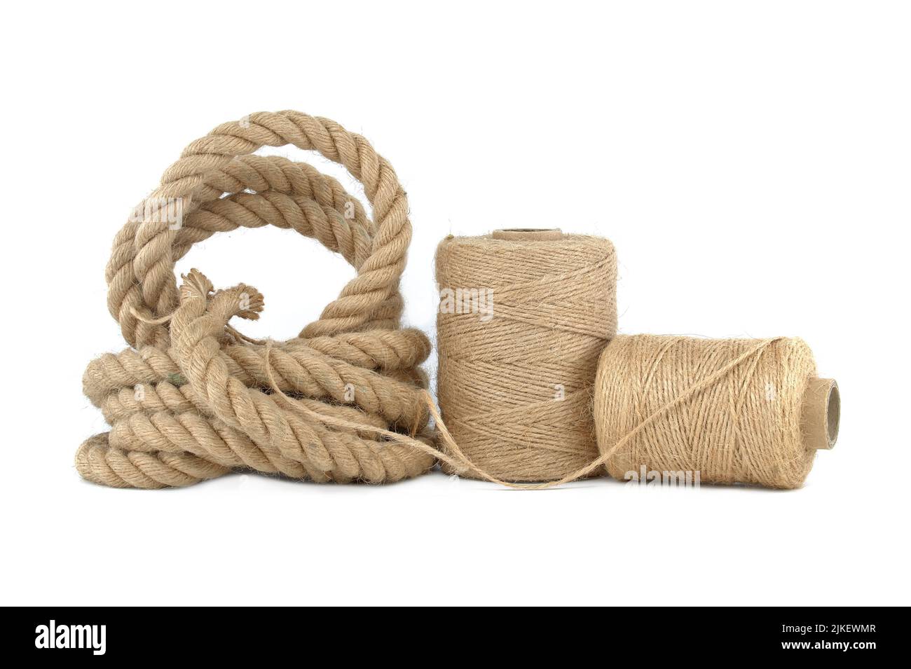 Twisted jute rope and spools of burlap threads or jute twine isolated ...