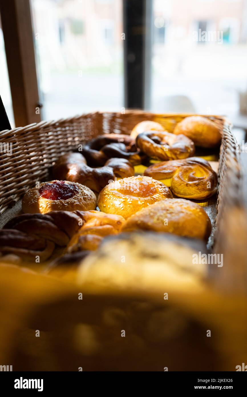 Pastries with sweet fillings at the bakery. Vertical photo Stock Photo ...