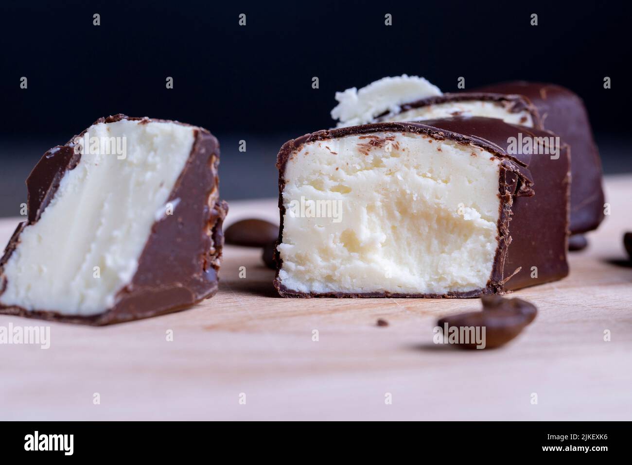 Chilled cottage cheese with sugar in chocolate, sweet dessert of ...