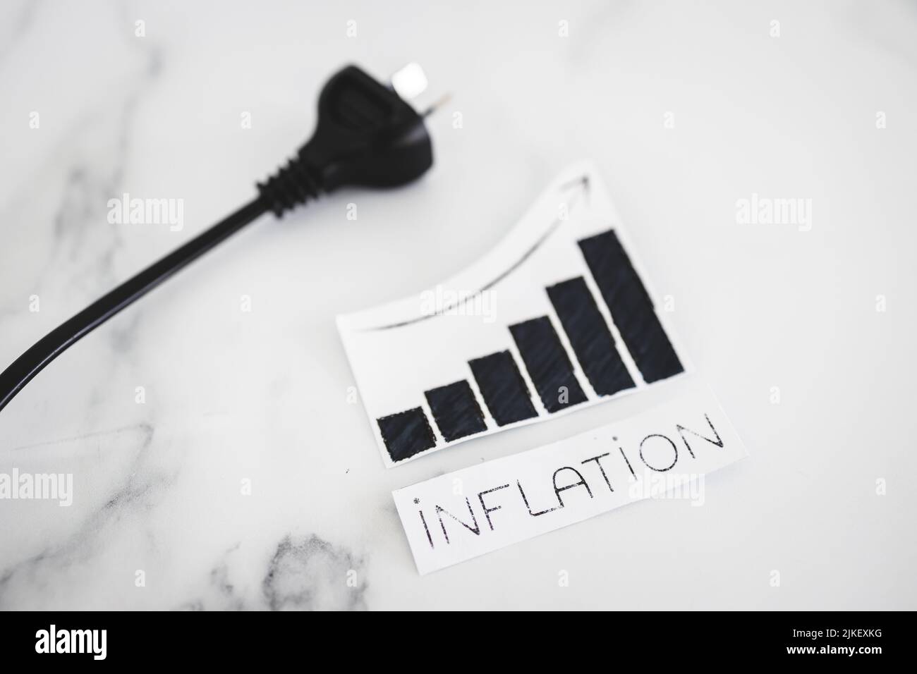 electricity costs going up ,conceptual image with plug nxt to stats ...