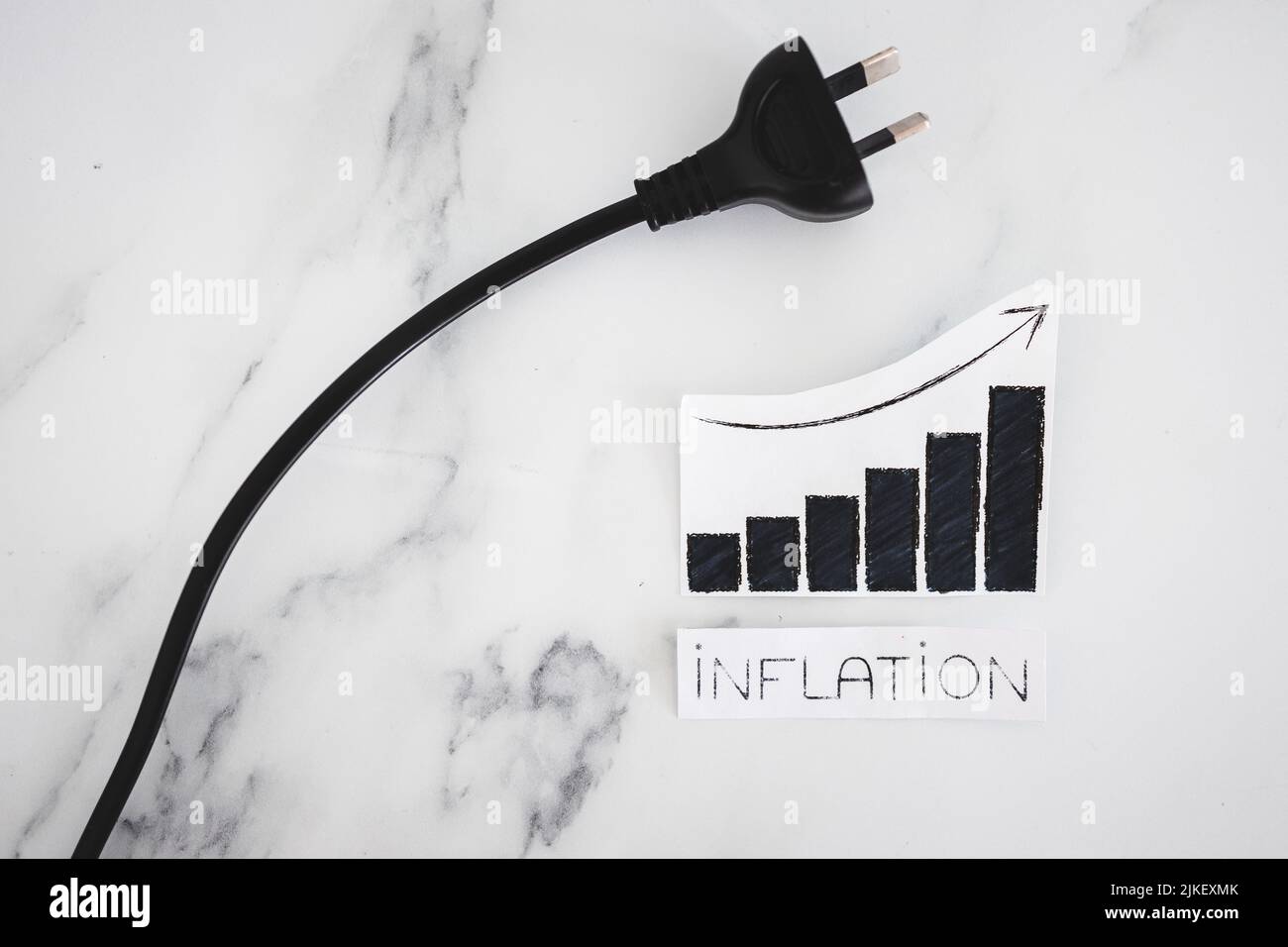 electricity costs going up ,conceptual image with plug nxt to stats ...