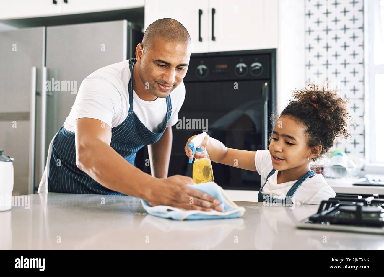If we work together, we get it done quicker. a young man cleaning a ...