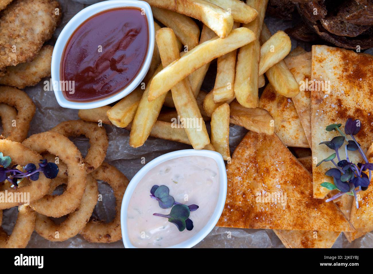 a set of different types of products fried together, French fries ...