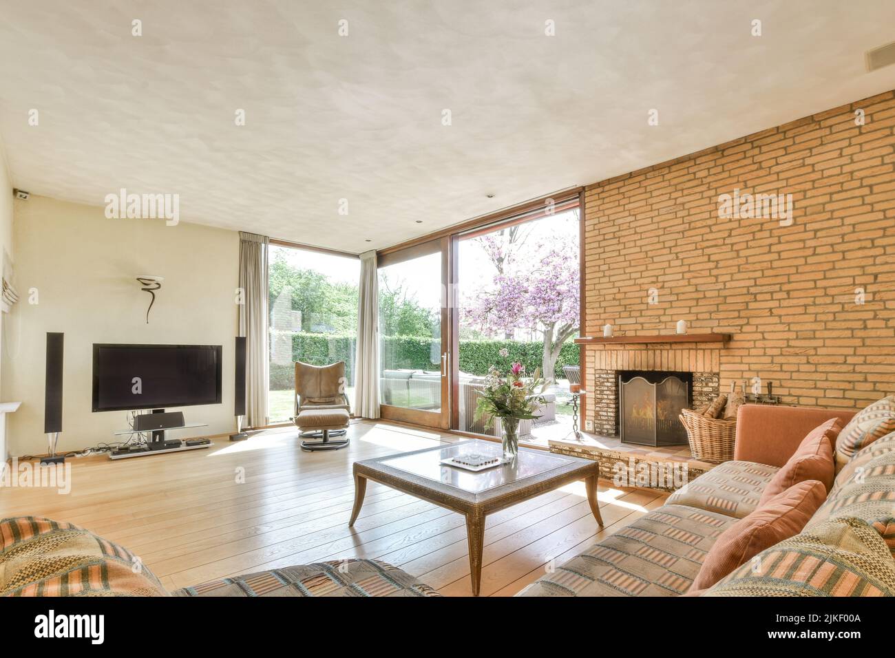Interior of modern room illuminated with sunlight from ceiling window ...