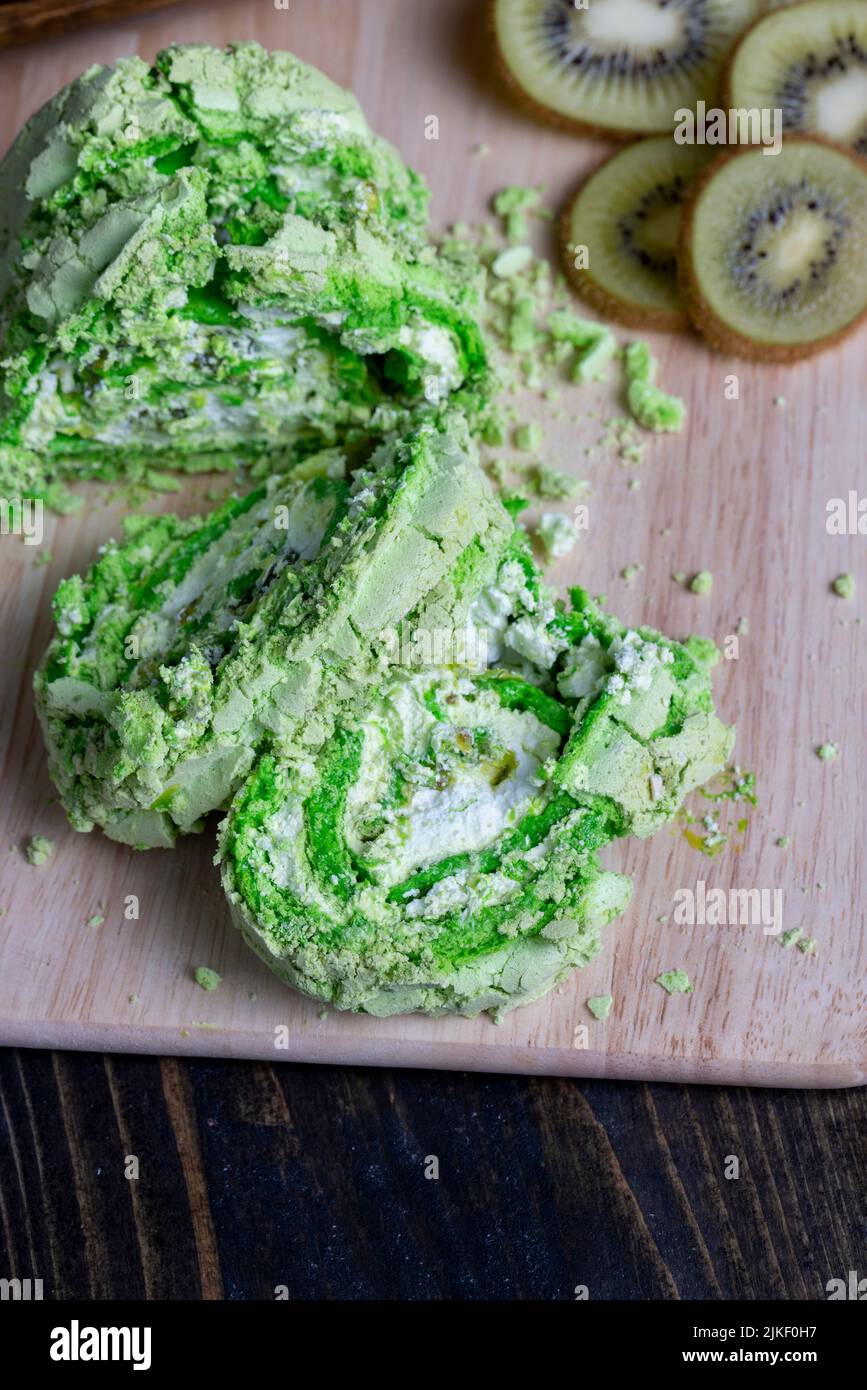 green cake with kiwi and gooseberry flavor, bright green roll with ...